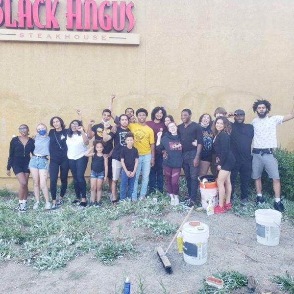 Protesters clean graffiti from vandalized Black Angus restaurant ...